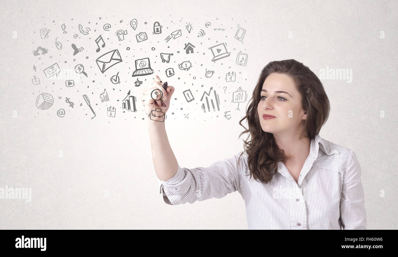 Young woman drawing and sketching icons and symbols Stock Photo - Alamy