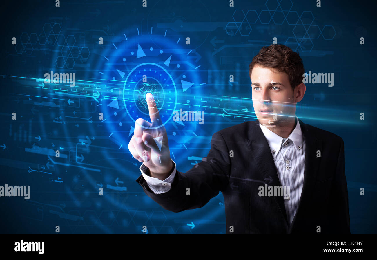 Handsome tech guy pressing high technology control panel screen concept ...
