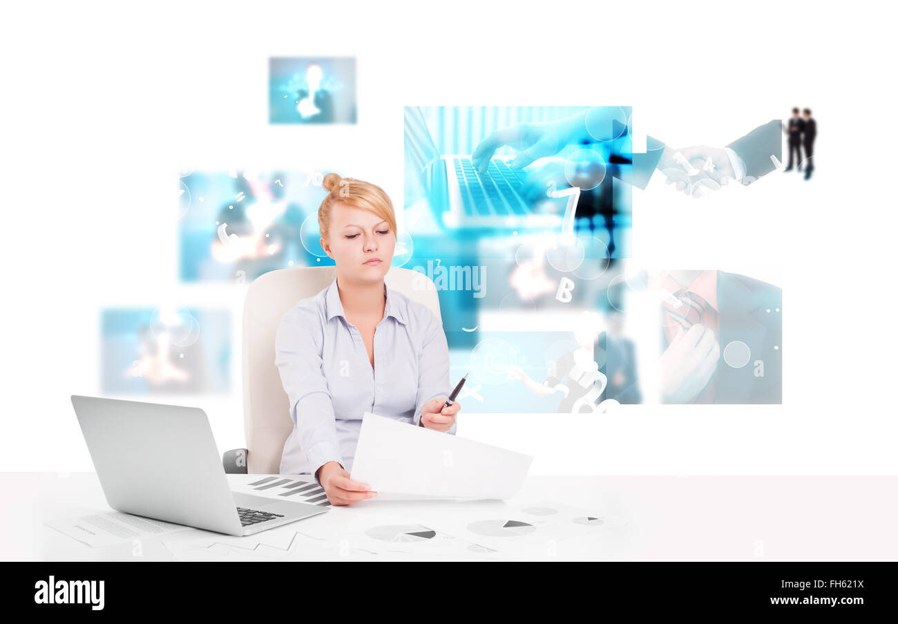 Business person at desk with modern tech images at background Stock ...