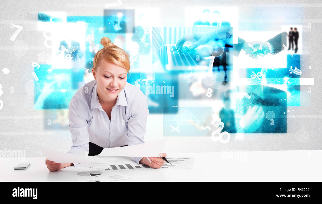 Business person at desk with modern tech images at background Stock ...