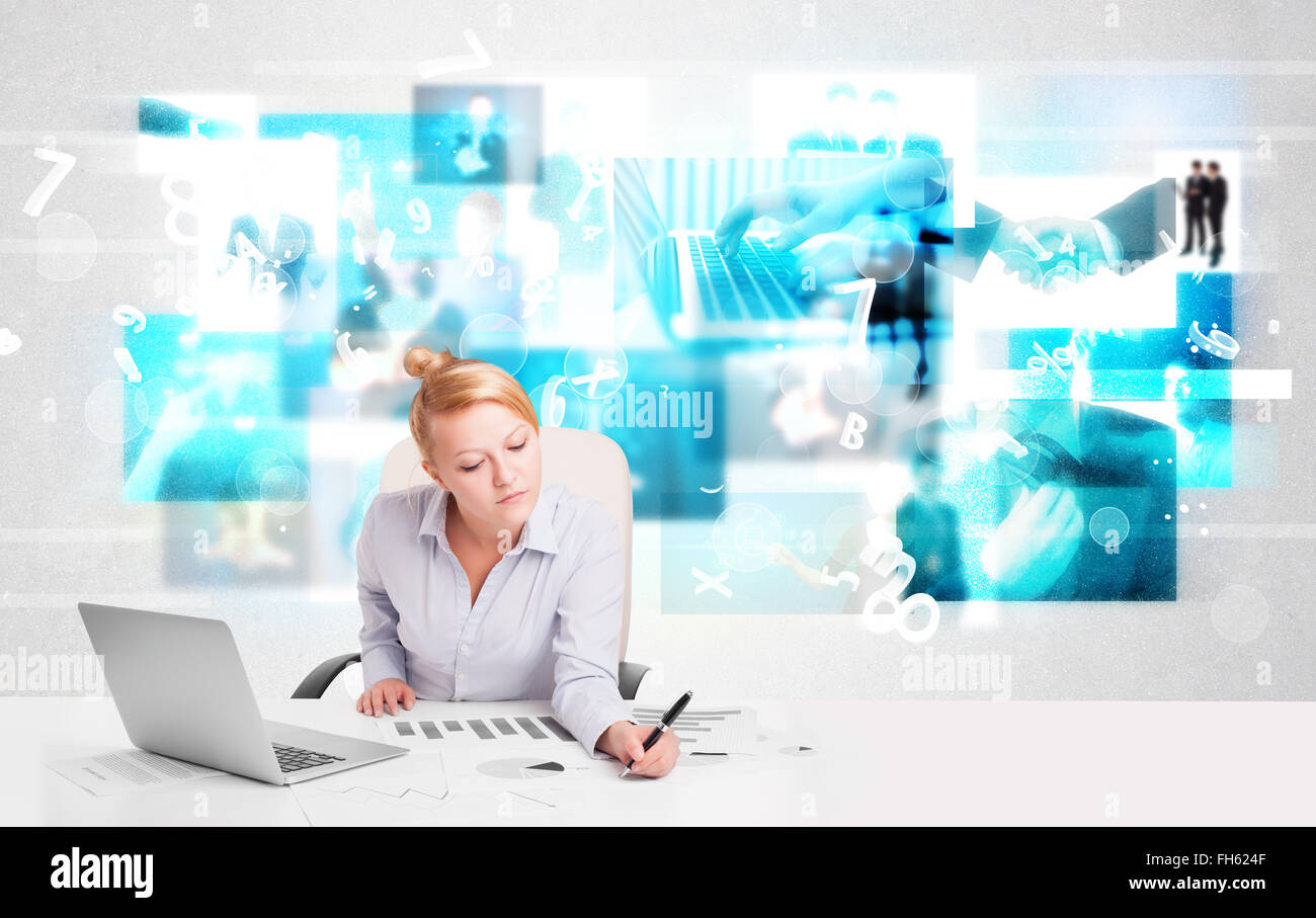 Business person at desk with modern tech images at background Stock ...