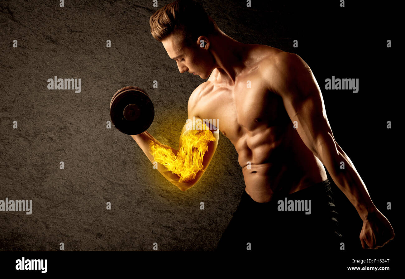 Muscular bodybuilder lifting weight with flaming biceps concept Stock ...