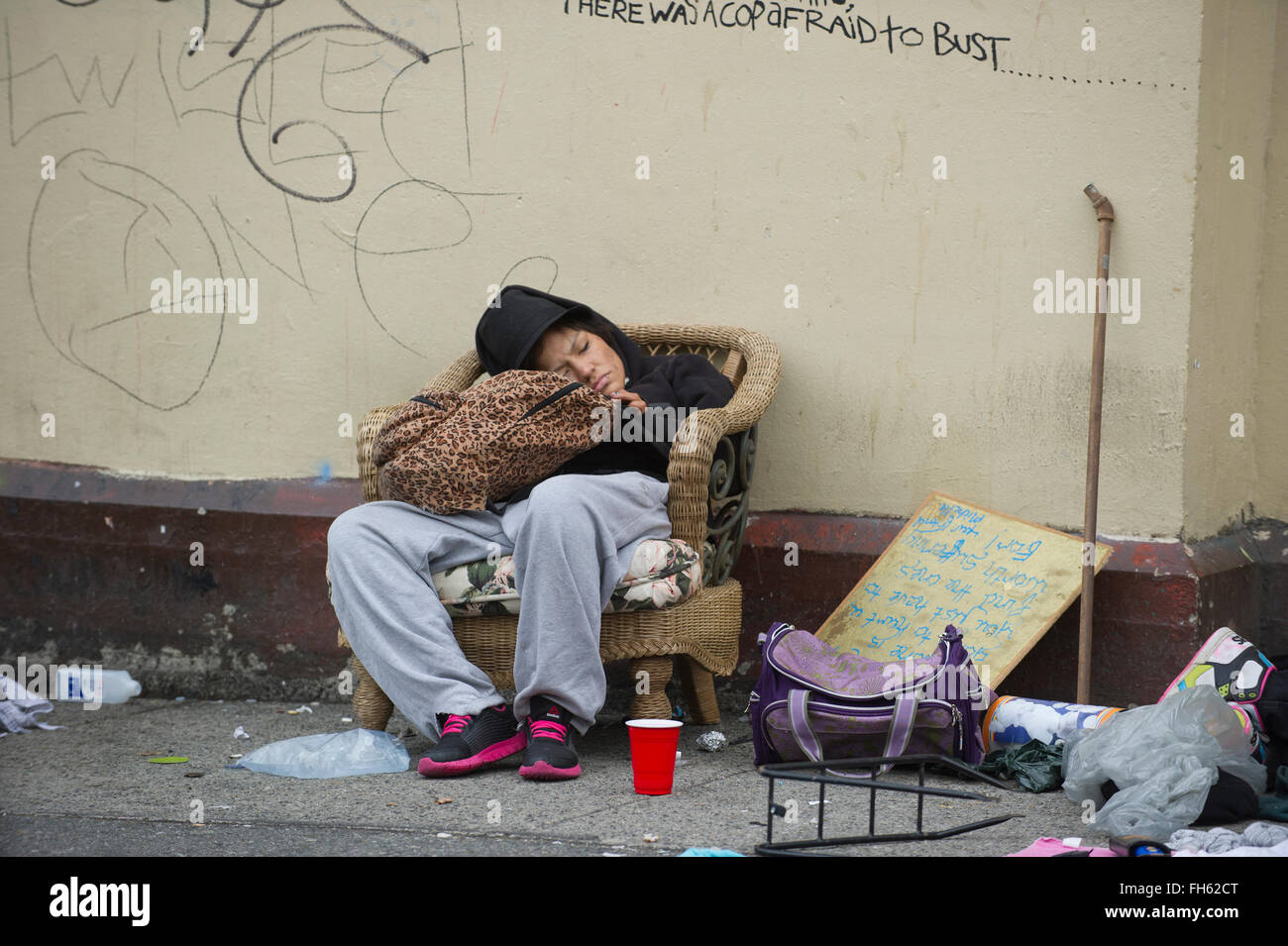 Homeless person asleep in a wicker chair on Vancouver Downtown Eastside ...