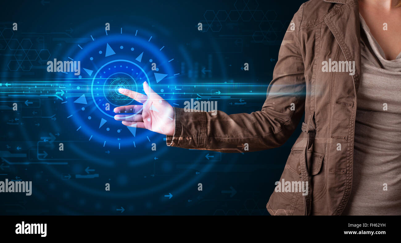 Young tech woman pressing high technology control panel screen concept ...