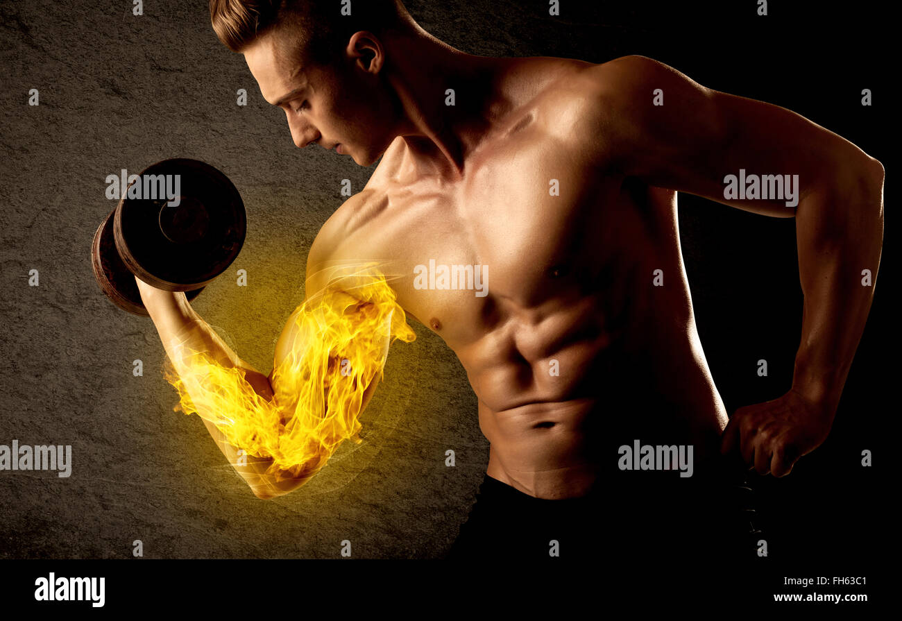 Muscular bodybuilder lifting weight with flaming biceps concept Stock ...