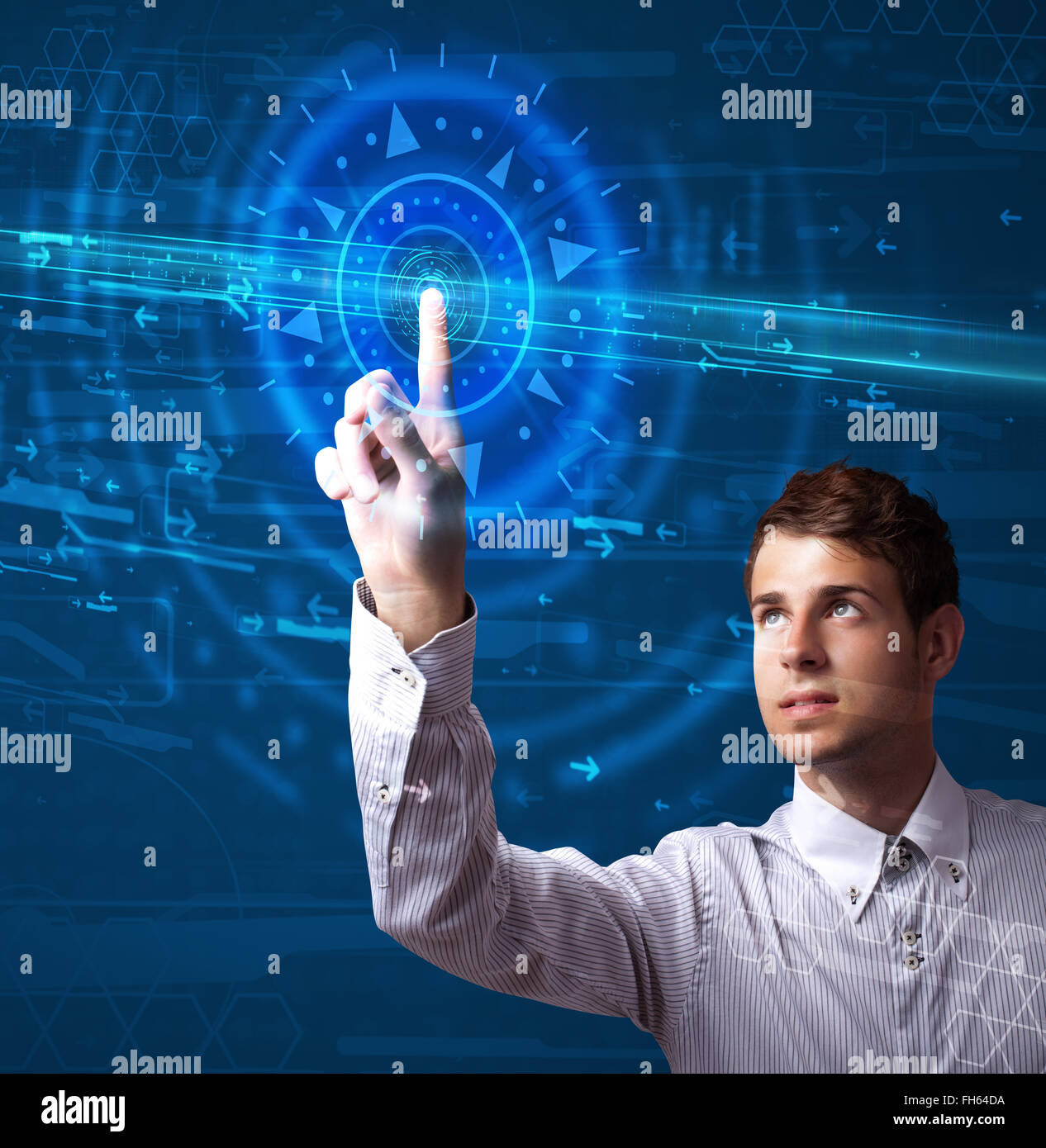 Handsome tech guy pressing high technology control panel screen concept ...