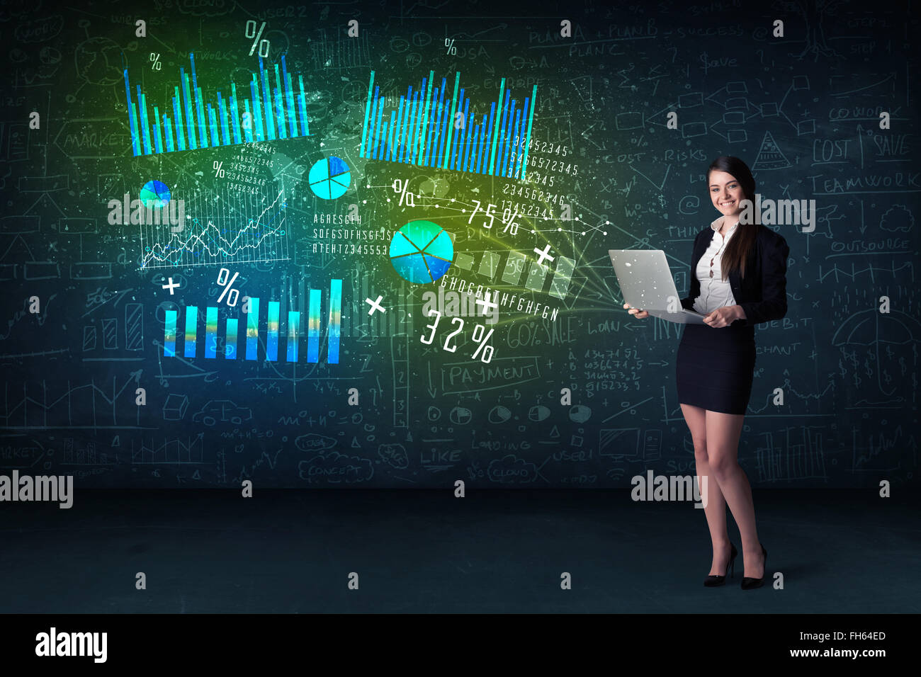 Businesswoman in office with laptop in hand and high tech graph charts ...
