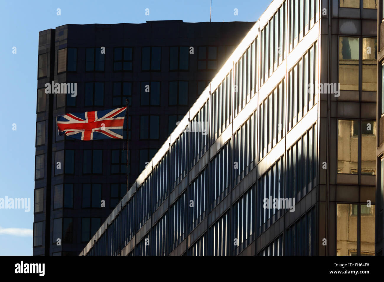 Backlit Union Jack flag and office building on Victoria Street ...