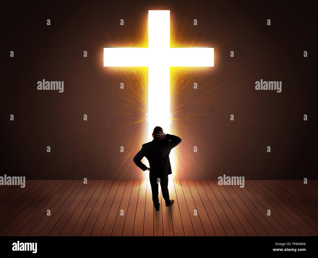 Man looking at bright cross sign Stock Photo - Alamy