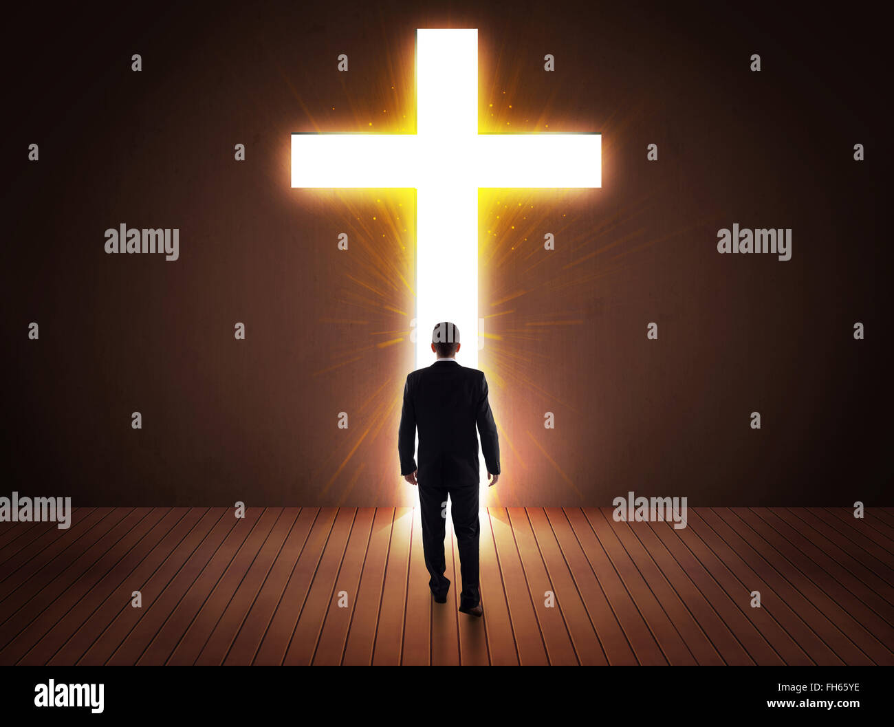 Man looking at bright cross sign Stock Photo - Alamy