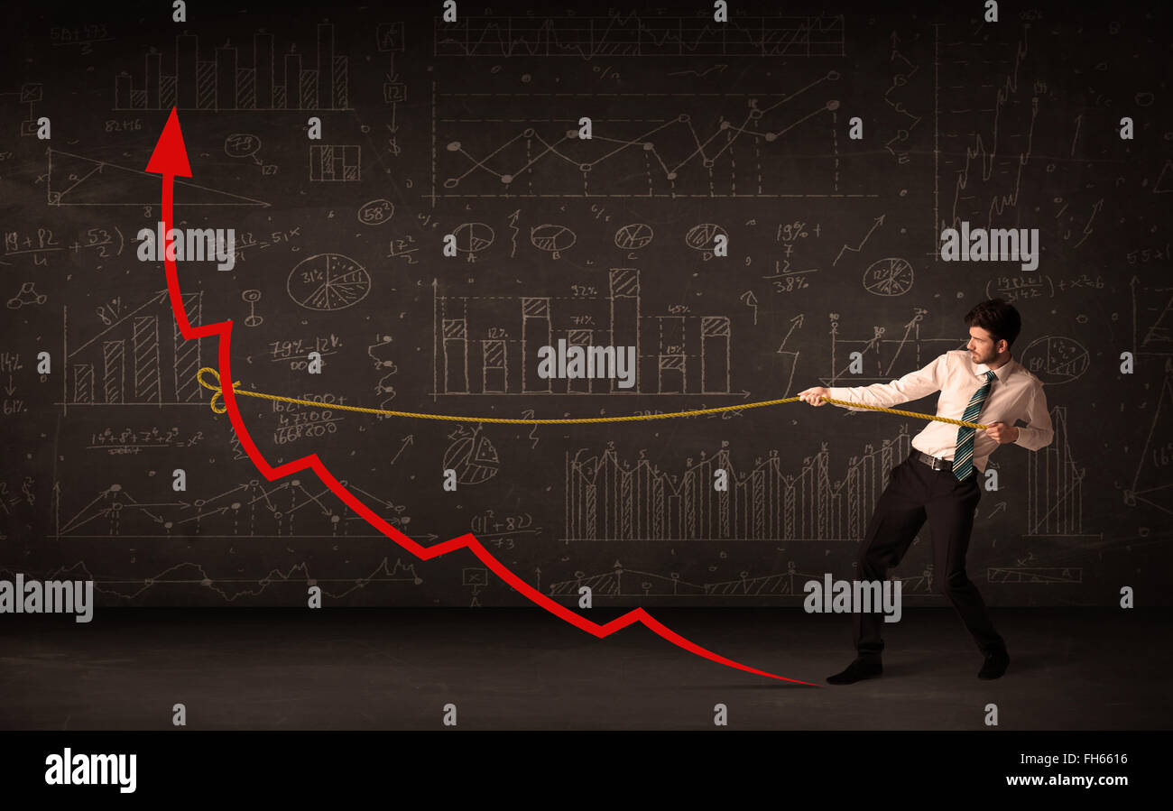Businessman pulling a red arrow upright with a rope Stock Photo - Alamy