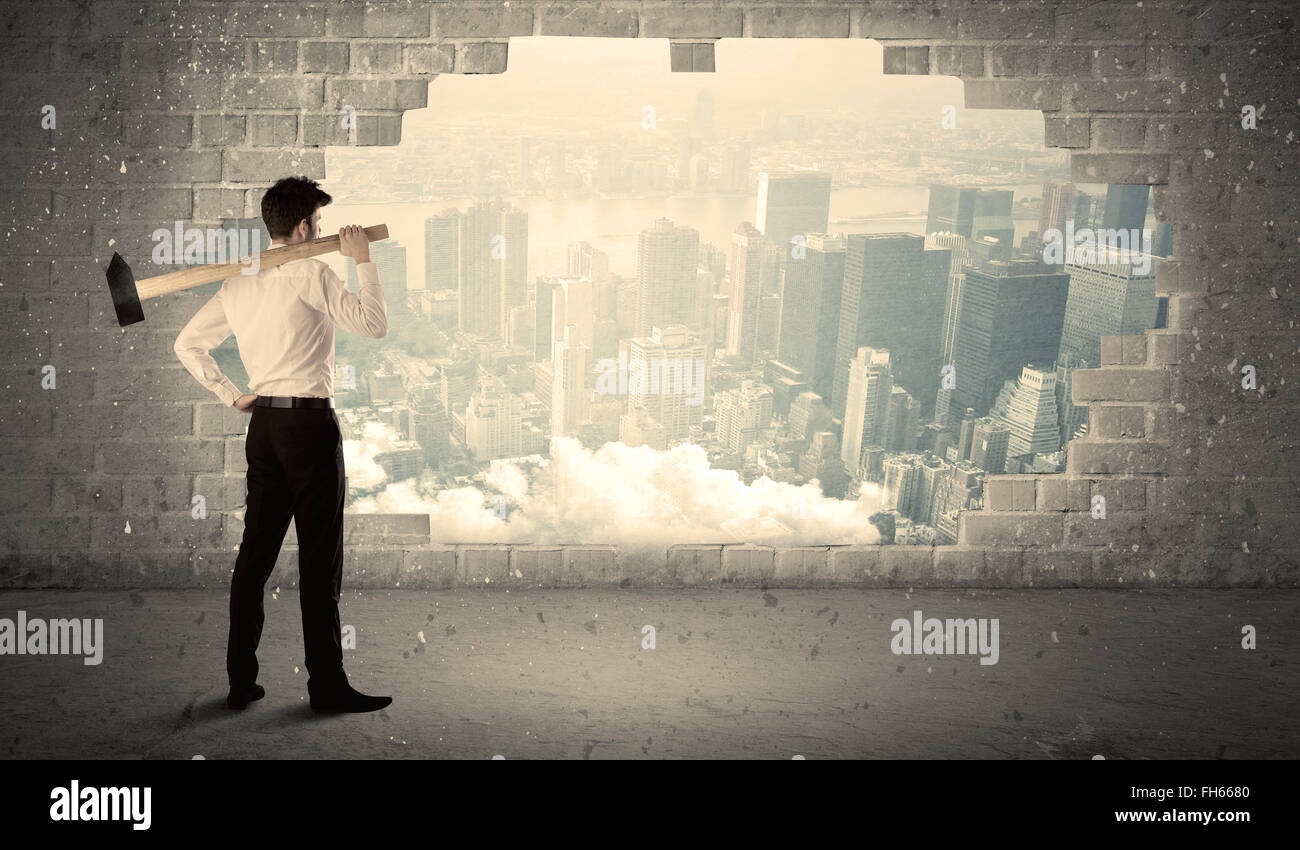 Business man hitting wall with hammer on city view Stock Photo - Alamy