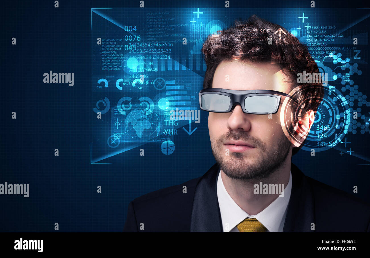 Young man looking with futuristic smart high tech glasses Stock Photo ...
