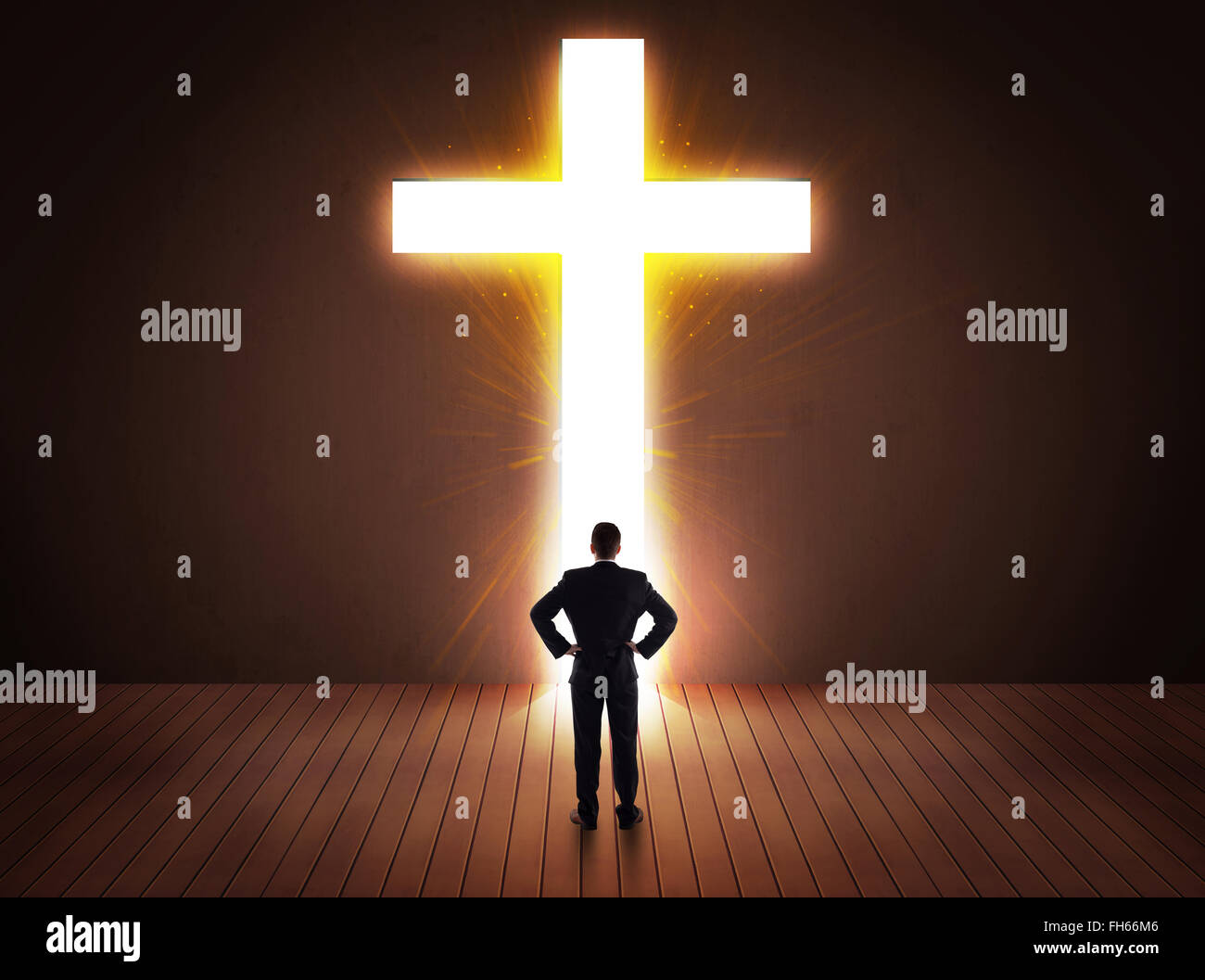 Man looking at bright cross sign Stock Photo - Alamy