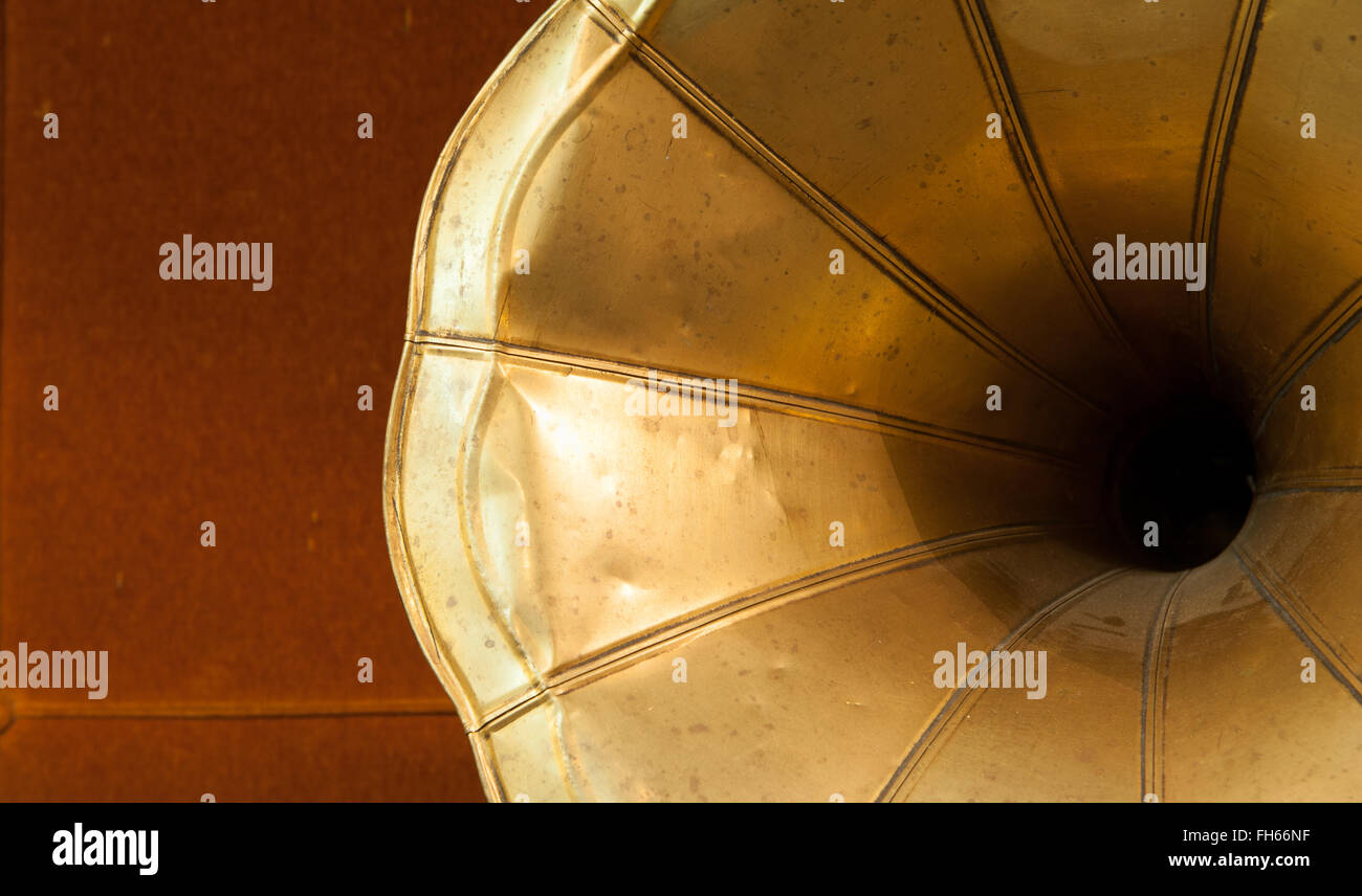 Old golden gramophone horn detail close up on wooden background Stock ...
