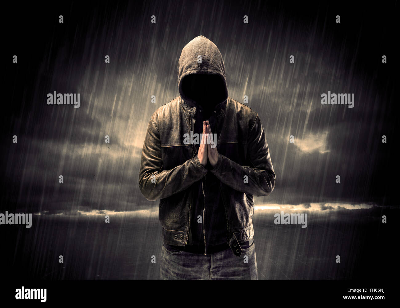 Anonymous terrorist in hoodie at night Stock Photo - Alamy