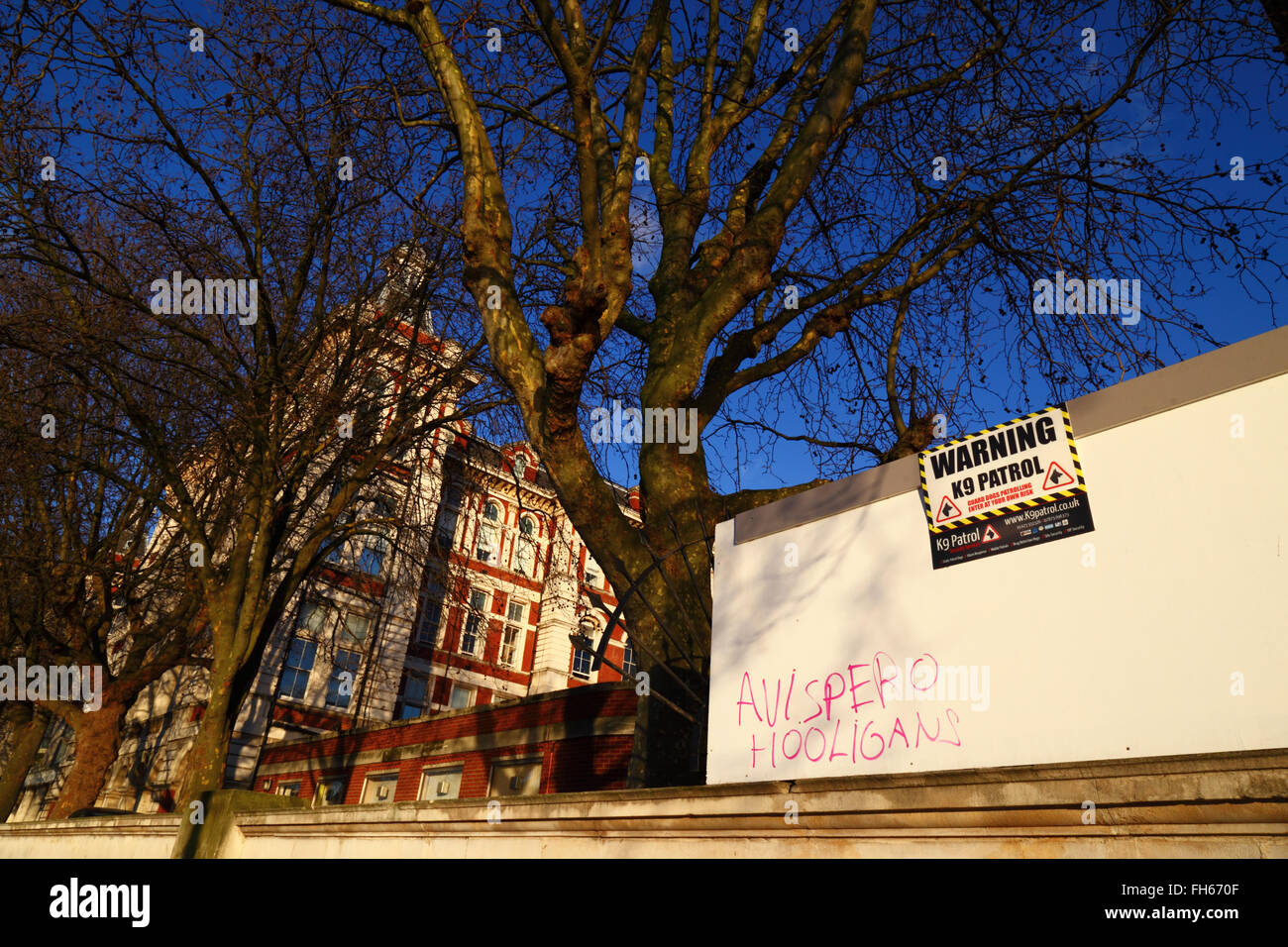 K9 guard dogs patrolling warning sign on wall, South Bank, Lambeth ...