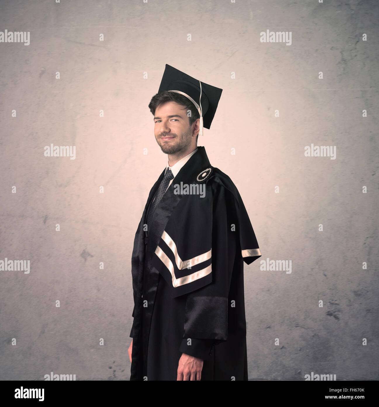 Portrait of a young graduate student on grungy background Stock Photo ...