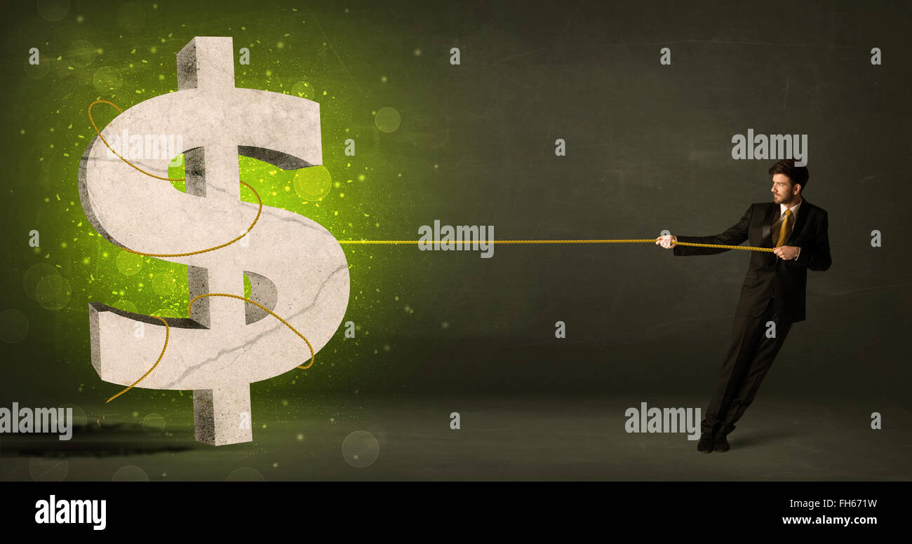 Business man pulling a big green dollar sign Stock Photo - Alamy