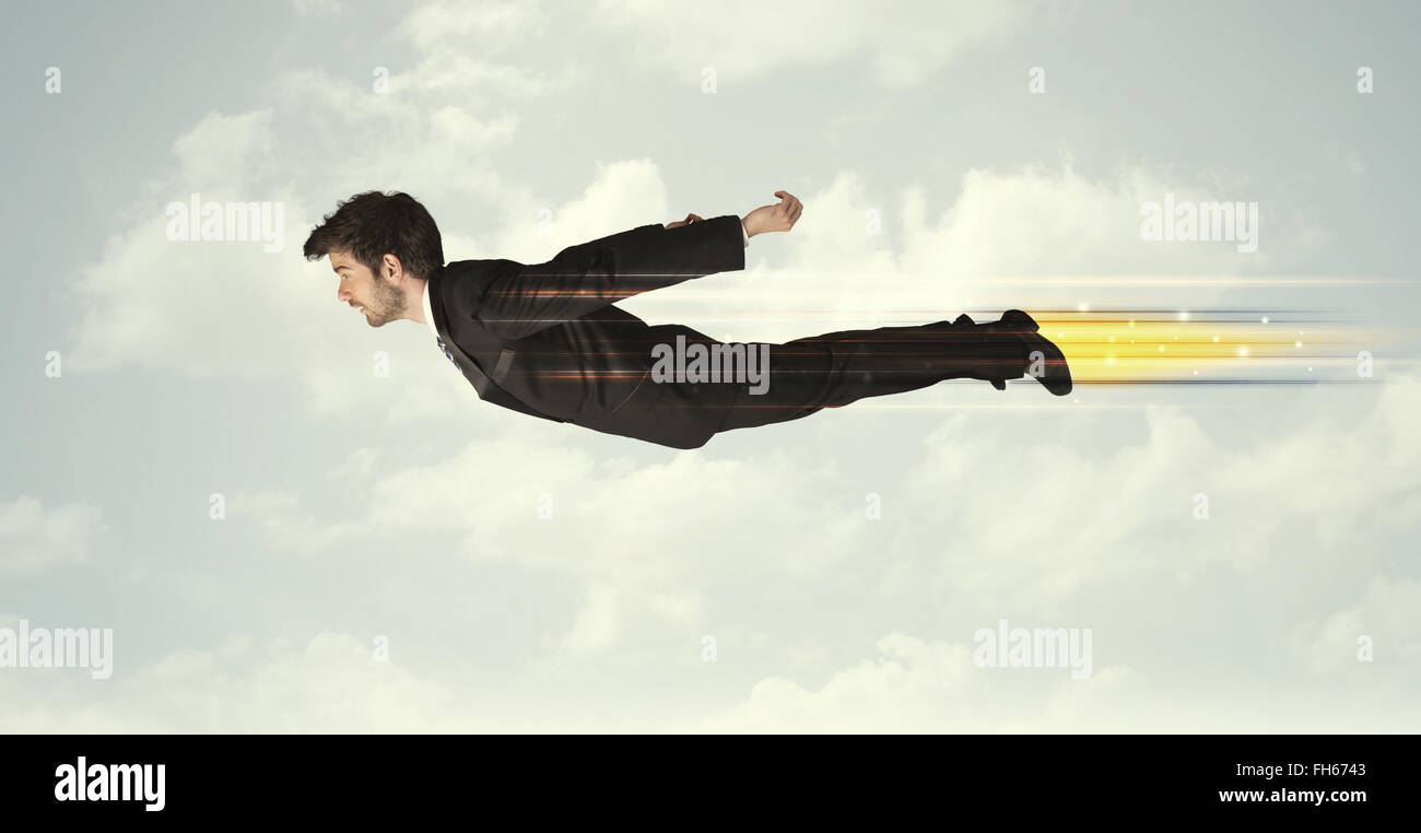 Happy business man flying fast on the sky between clouds Stock Photo ...
