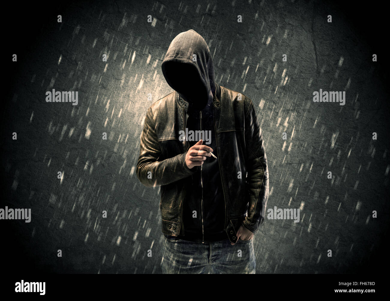 Unknown suspect standing in the dark Stock Photo - Alamy