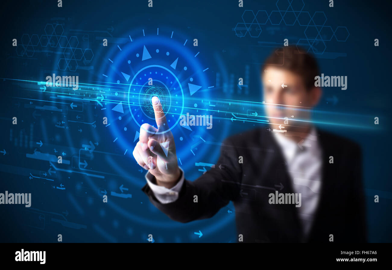 Handsome tech guy pressing high technology control panel screen concept ...