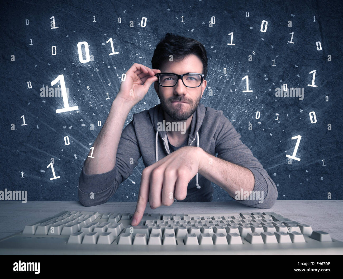 Online intruder geek guy hacking codes Stock Photo - Alamy