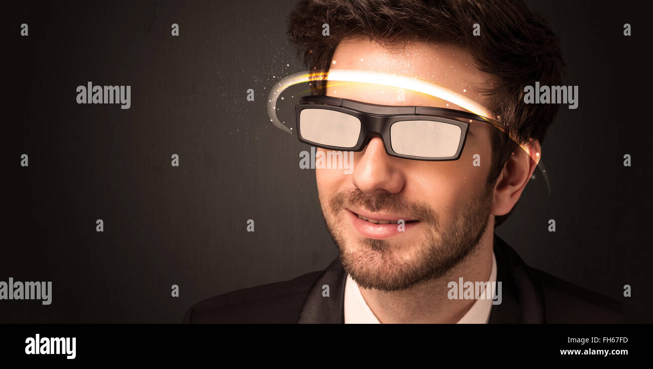 Handsome man looking with futuristic high tech glasses Stock Photo - Alamy