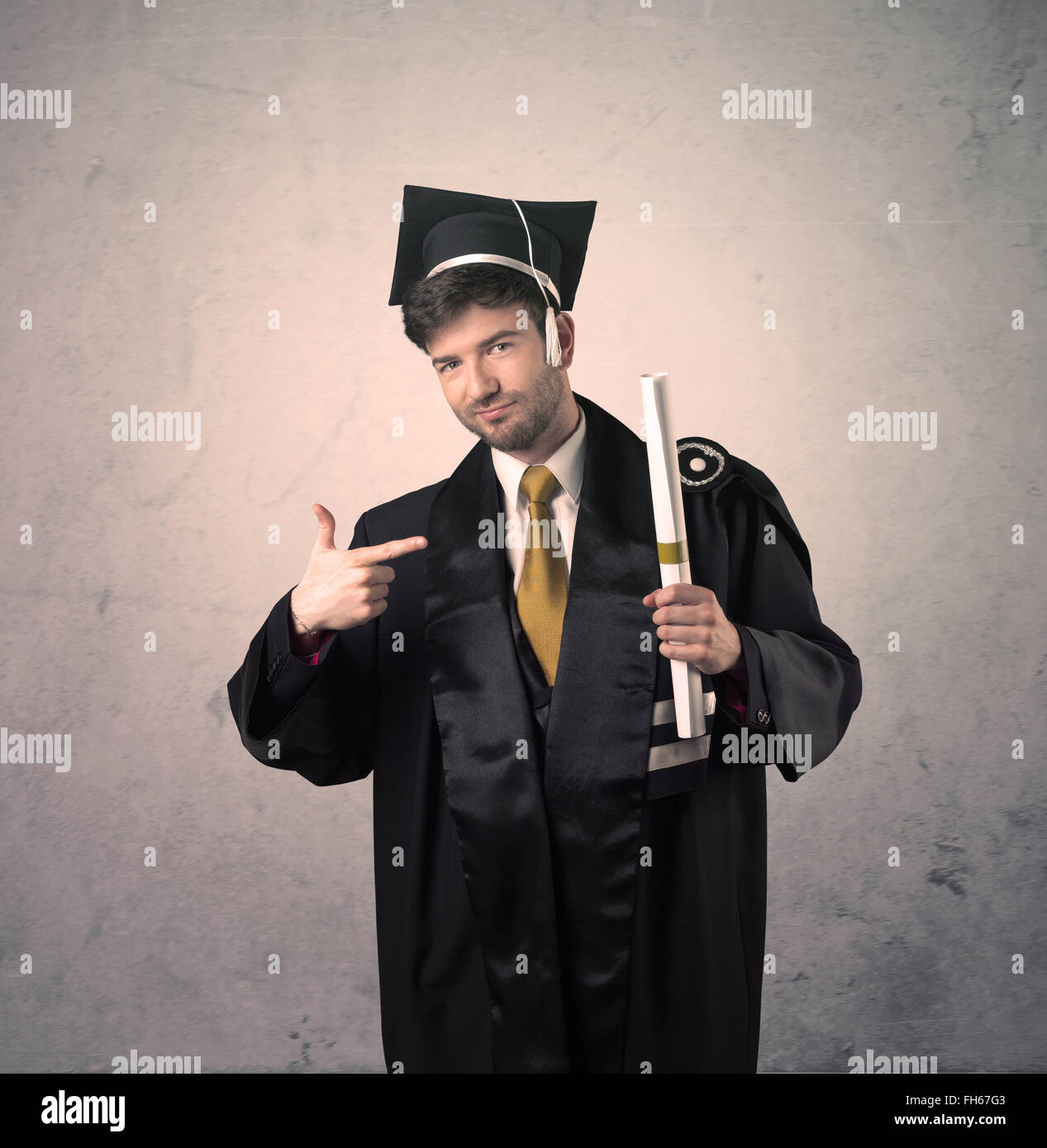 Portrait of a young graduate student on grungy background Stock Photo ...