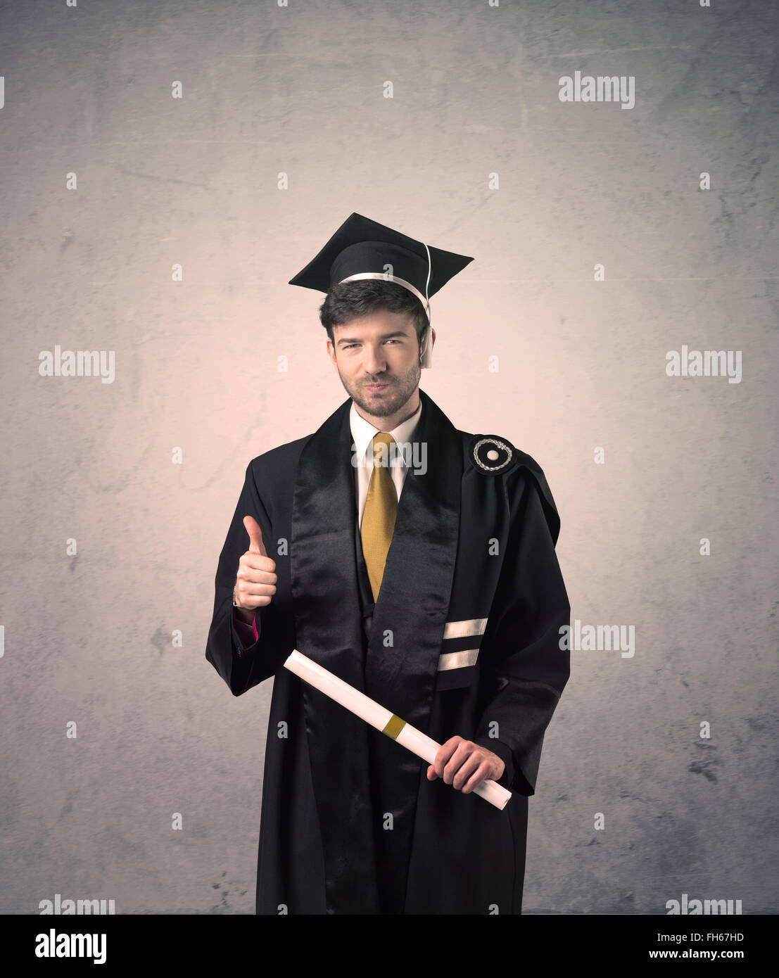 Portrait of a young graduate student on grungy background Stock Photo ...