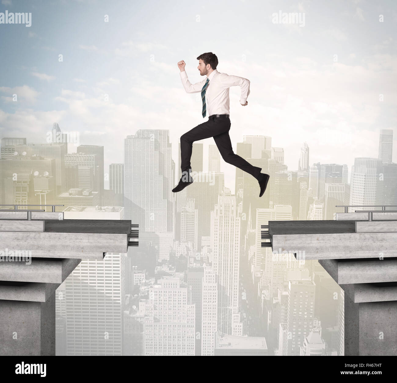 Energetic business man jumping over a bridge with gap Stock Photo - Alamy