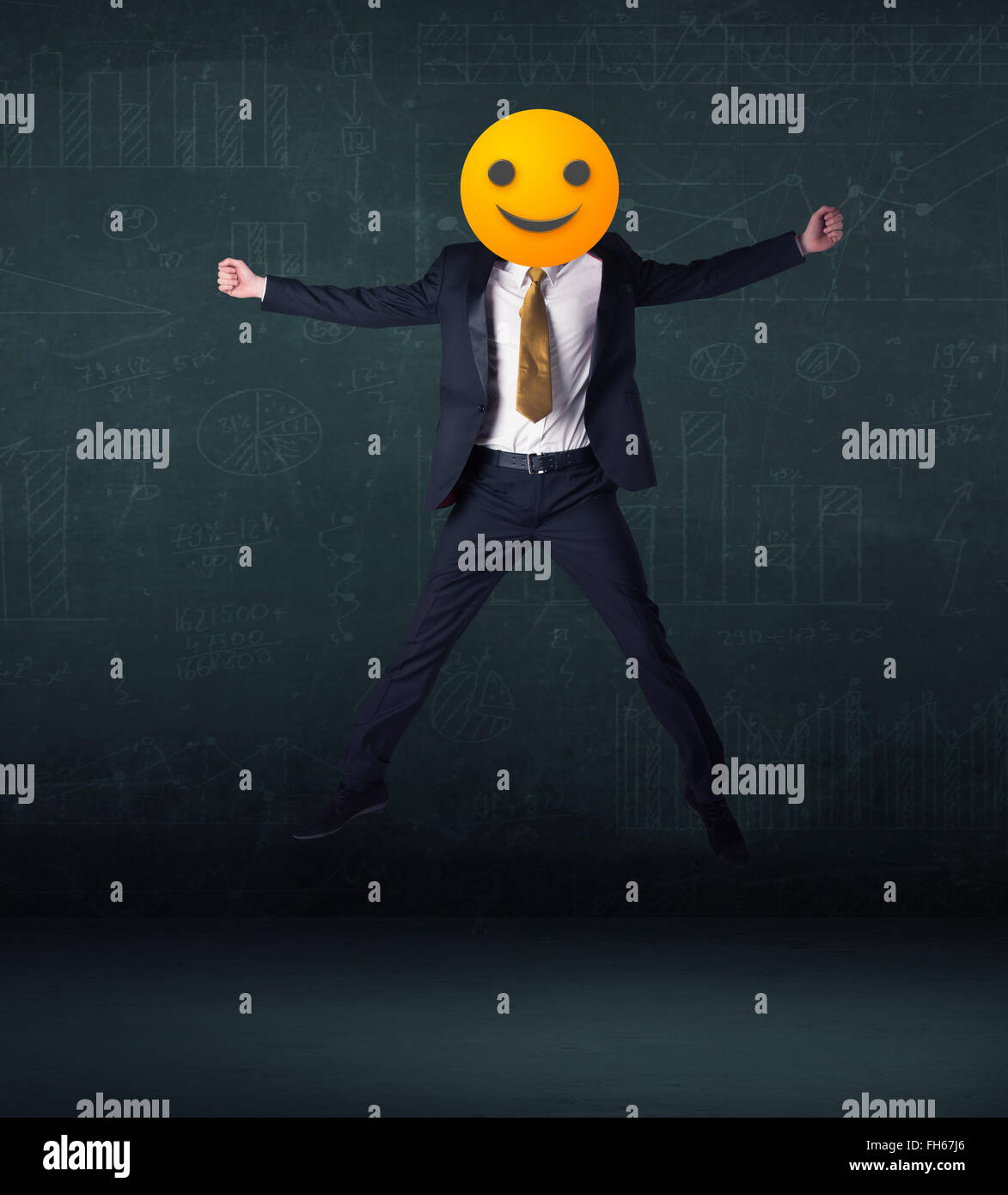 businessman wears yellow smiley face Stock Photo - Alamy
