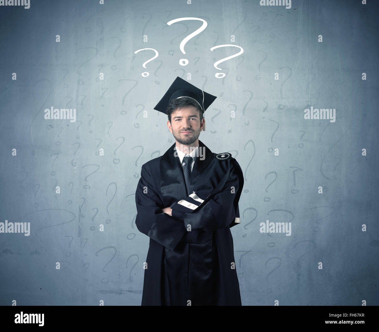 Young graduate teenager with question marks drawn Stock Photo - Alamy