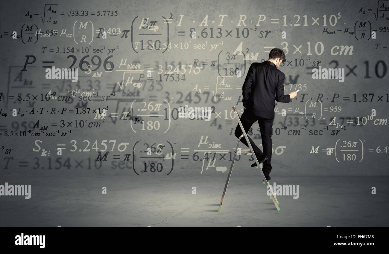Man calculating from ladder Stock Photo - Alamy