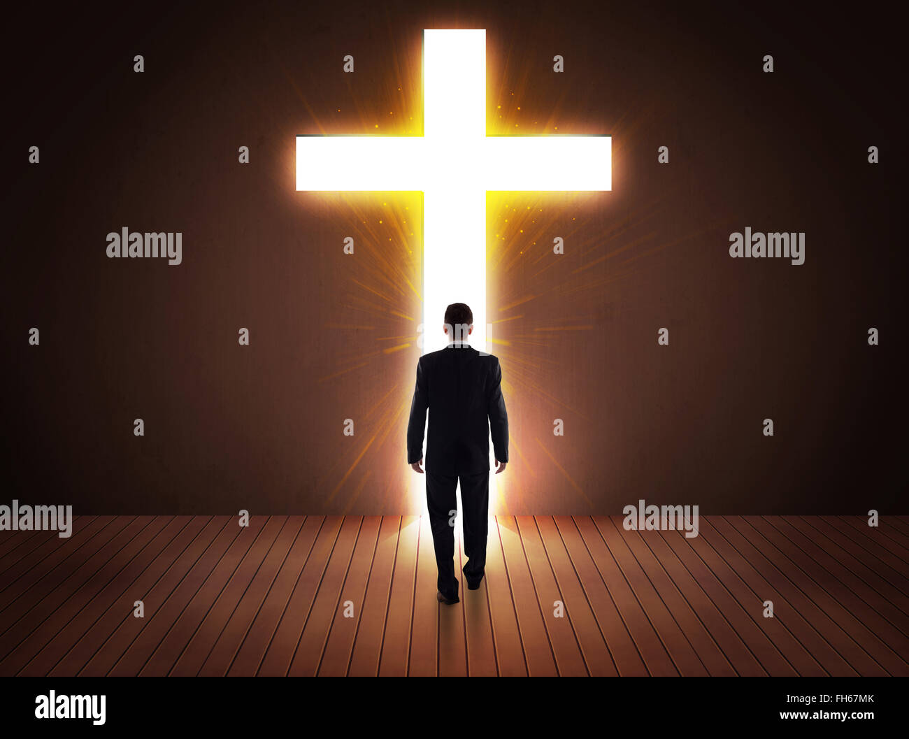 Man looking at bright cross sign Stock Photo - Alamy