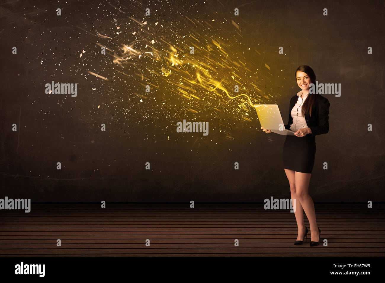 Businesswoman with laptop and energy explosion on background Stock ...