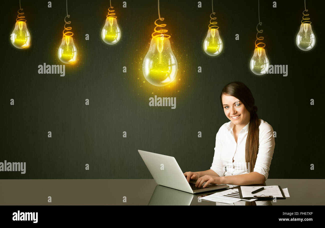 Businesswoman with idea bulbs Stock Photo - Alamy