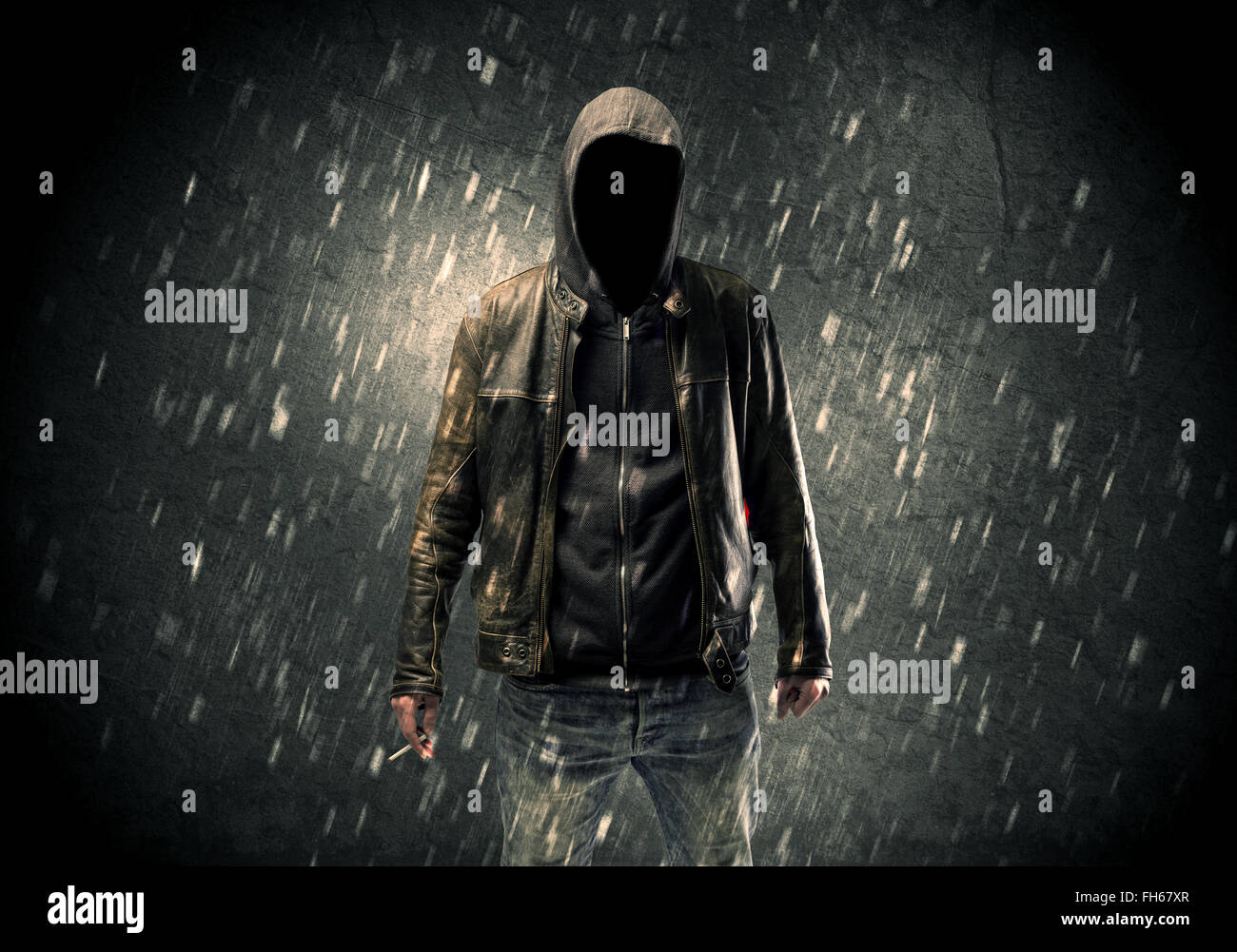 Unknown suspect standing in the dark Stock Photo - Alamy