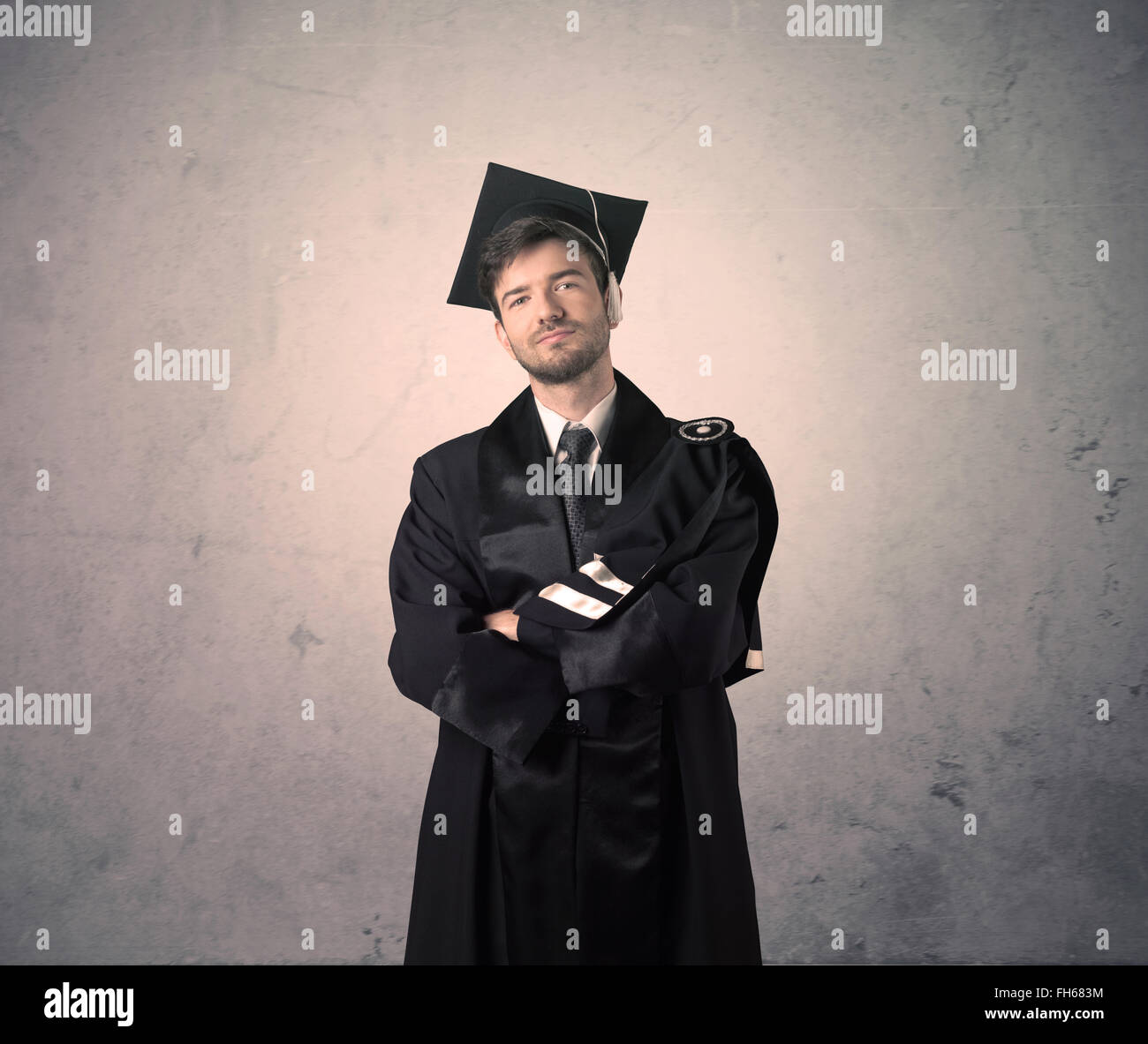 Portrait of a young graduate student on grungy background Stock Photo ...
