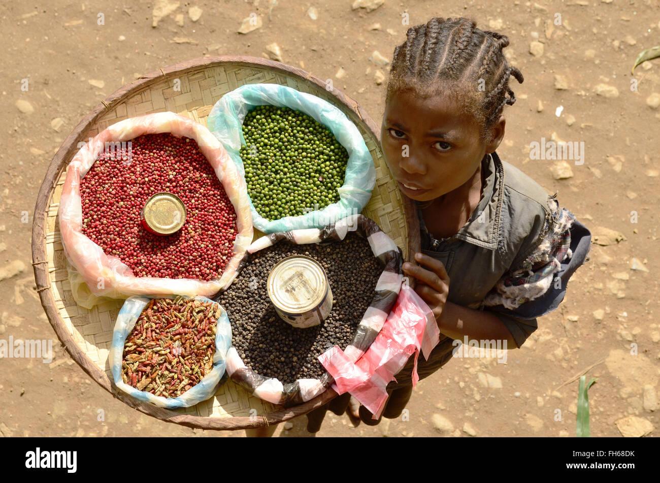 Girl selling spices in Madagascar Stock Photo - Alamy