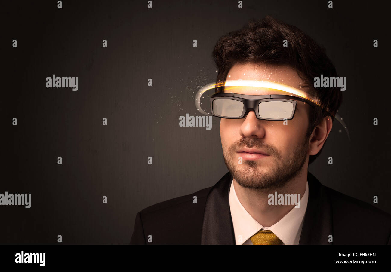 Handsome man looking with futuristic high tech glasses Stock Photo - Alamy