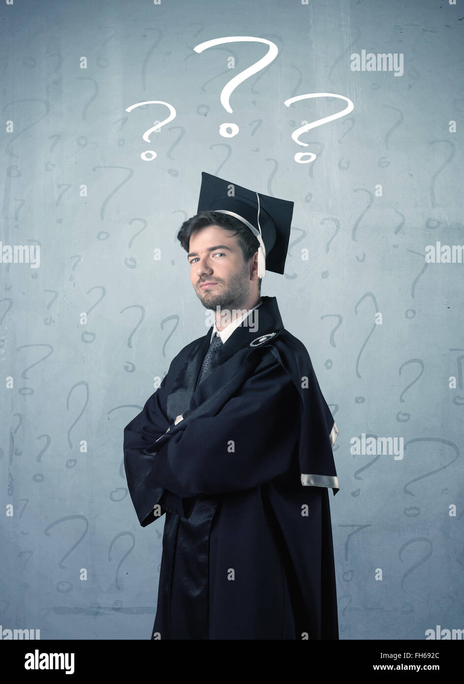 Young graduate teenager with question marks drawn Stock Photo - Alamy