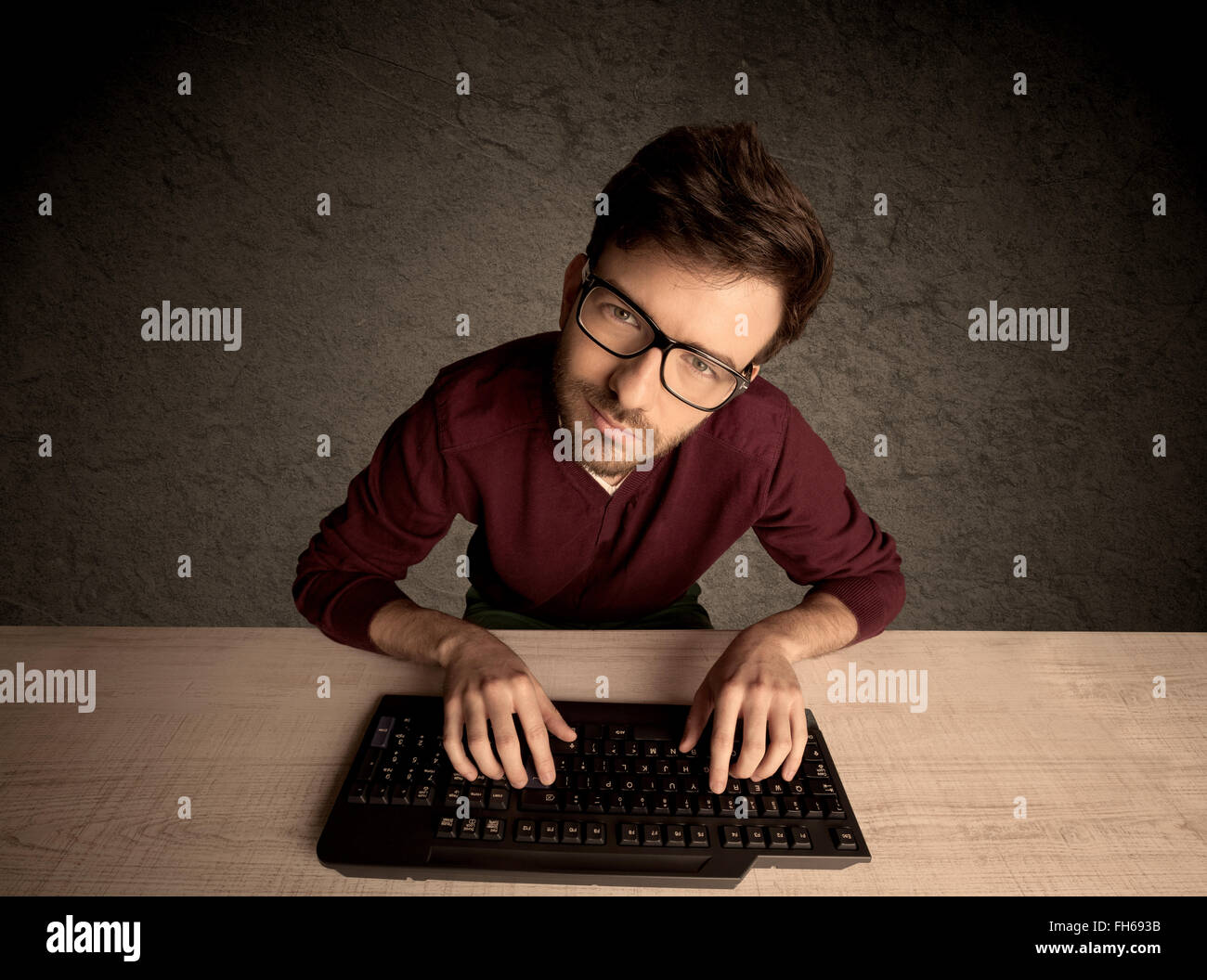 Computer geek typing on keyboard Stock Photo - Alamy