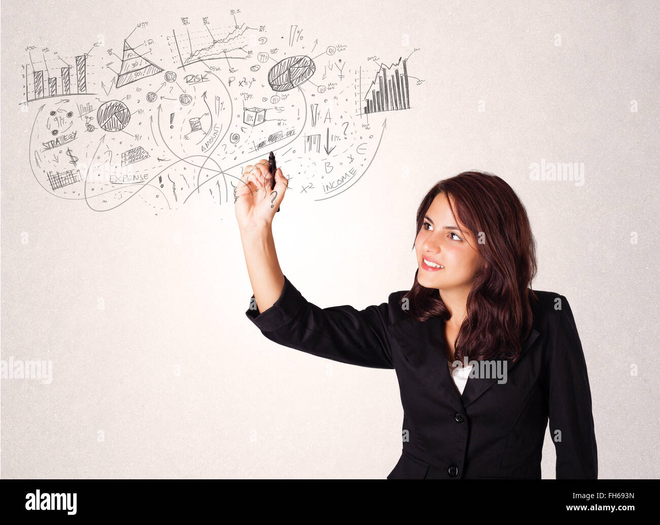 Pretty girl sketching graphs and diagrams on wall Stock Photo - Alamy