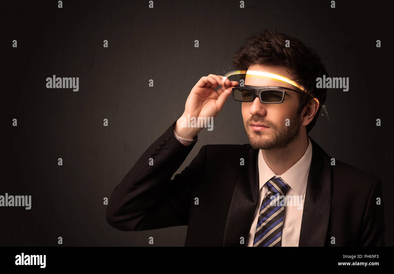 Handsome man looking with futuristic high tech glasses Stock Photo - Alamy