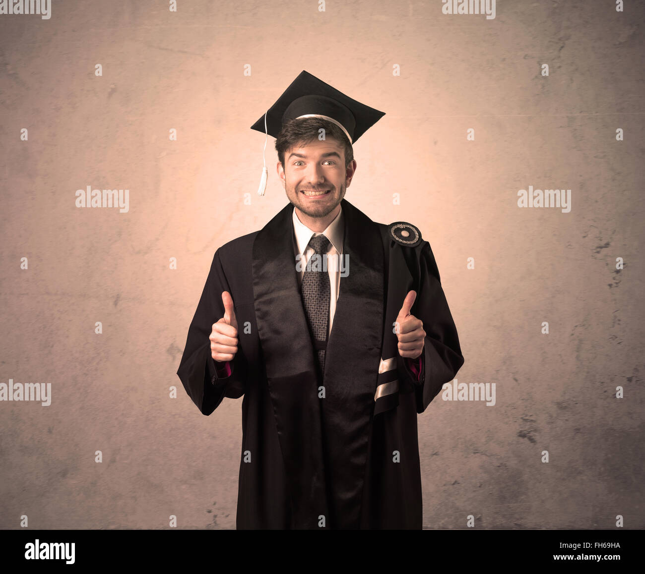 Portrait of a young graduate student on grungy background Stock Photo ...
