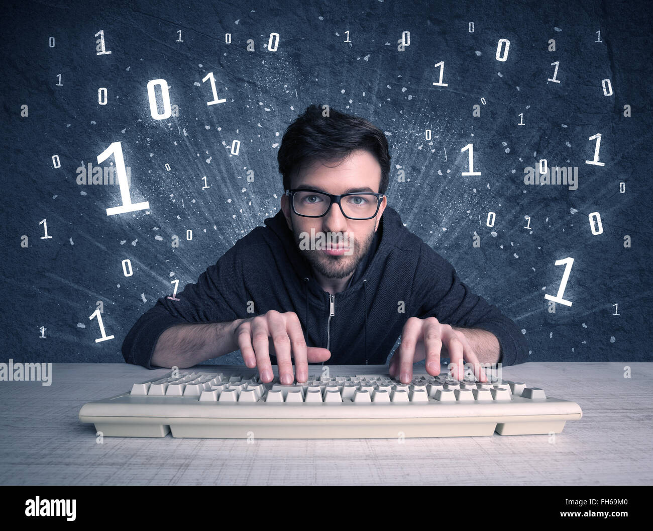 Online intruder geek guy hacking codes Stock Photo - Alamy