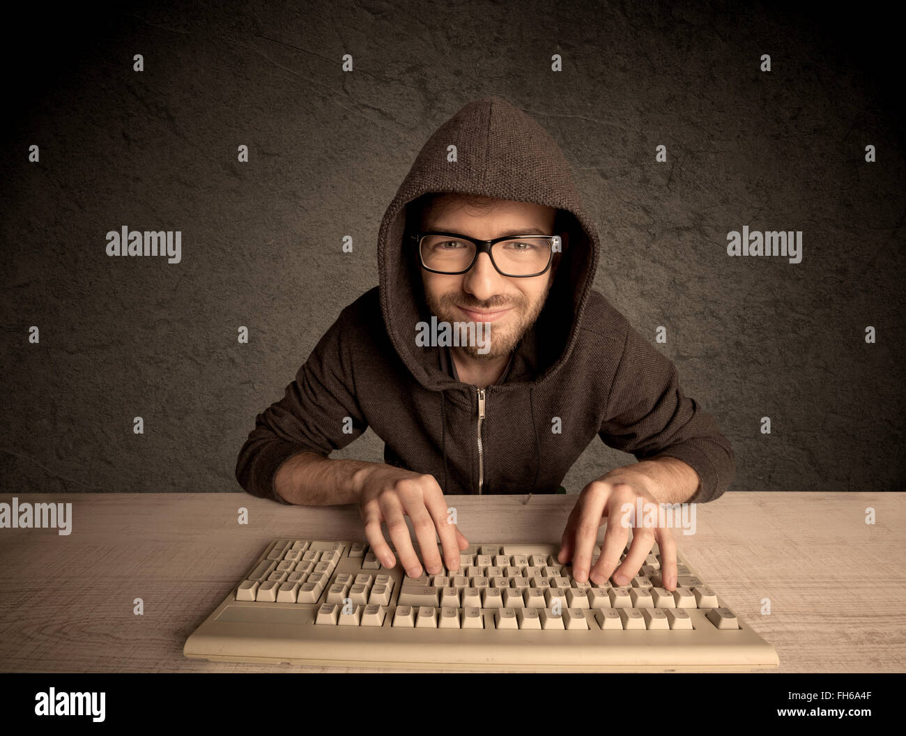 Computer geek typing on keyboard Stock Photo - Alamy