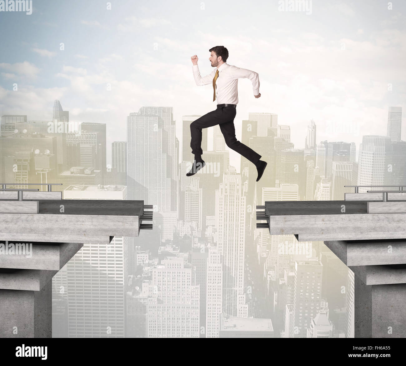 Energetic business man jumping over a bridge with gap Stock Photo - Alamy