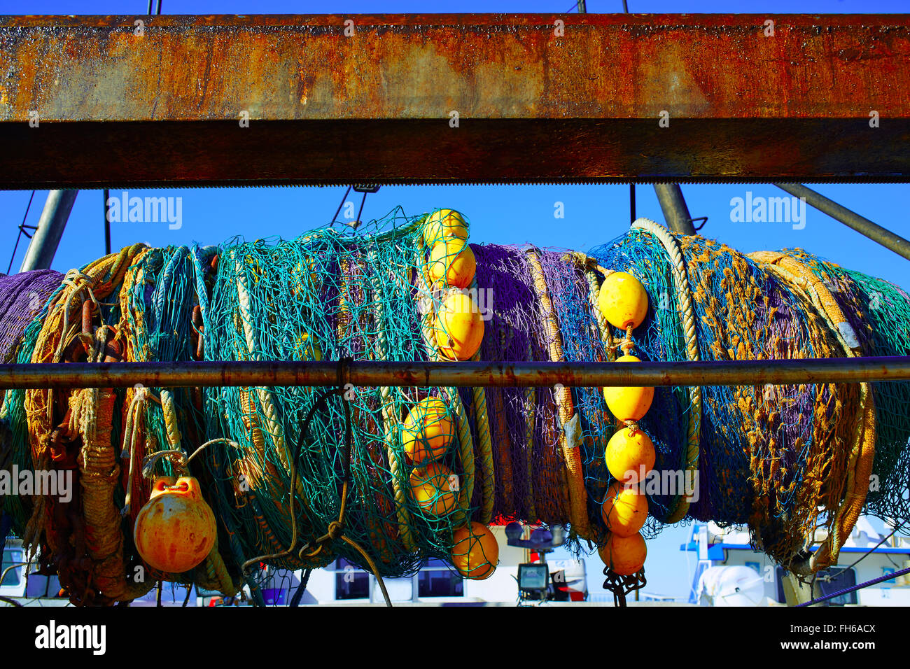 Trawler boat net rolled in its axis from Mediterranean port Stock Photo ...